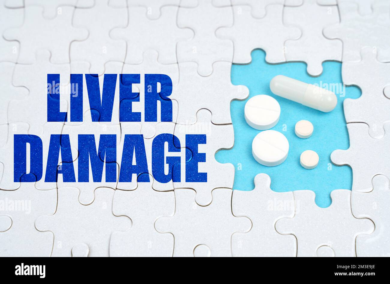 Medical concept. On the puzzles there is an inscription - Liver Damage ...