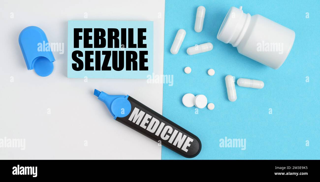 Medical concept. On the white and blue surface are pills, a marker and ...