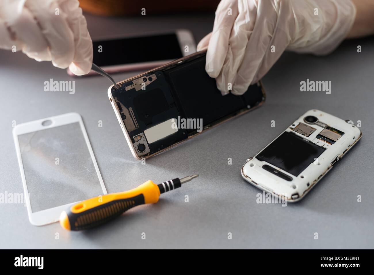 Close-up photos showing process of mobile phone repair Stock Photo - Alamy