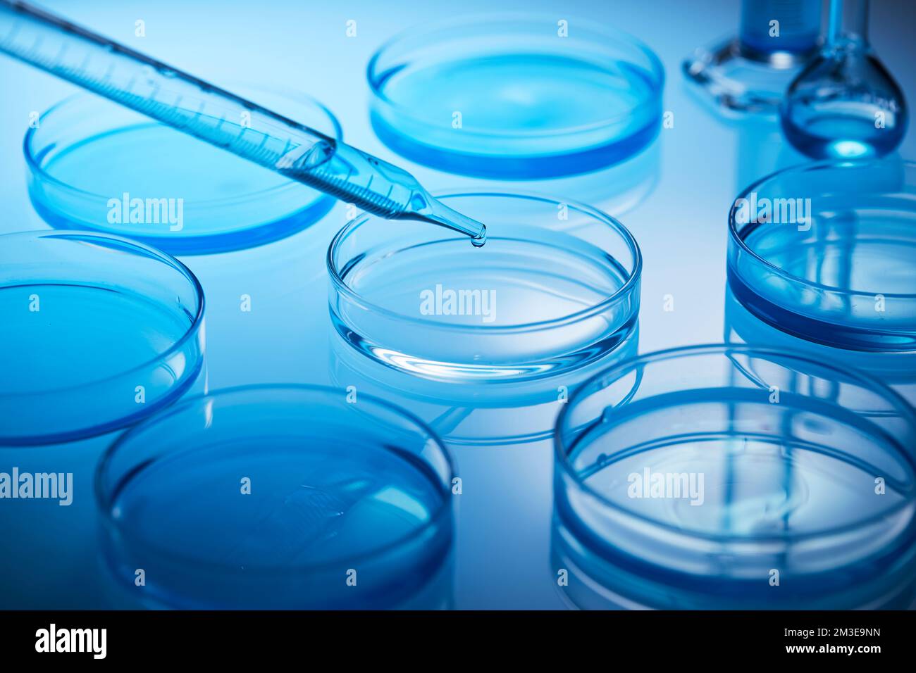 science lab with clear blue background and test tubes with blue ...