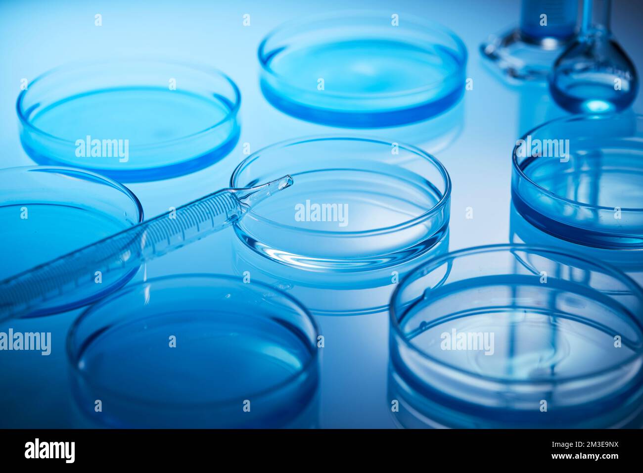science lab with clear blue background and test tubes with blue ...