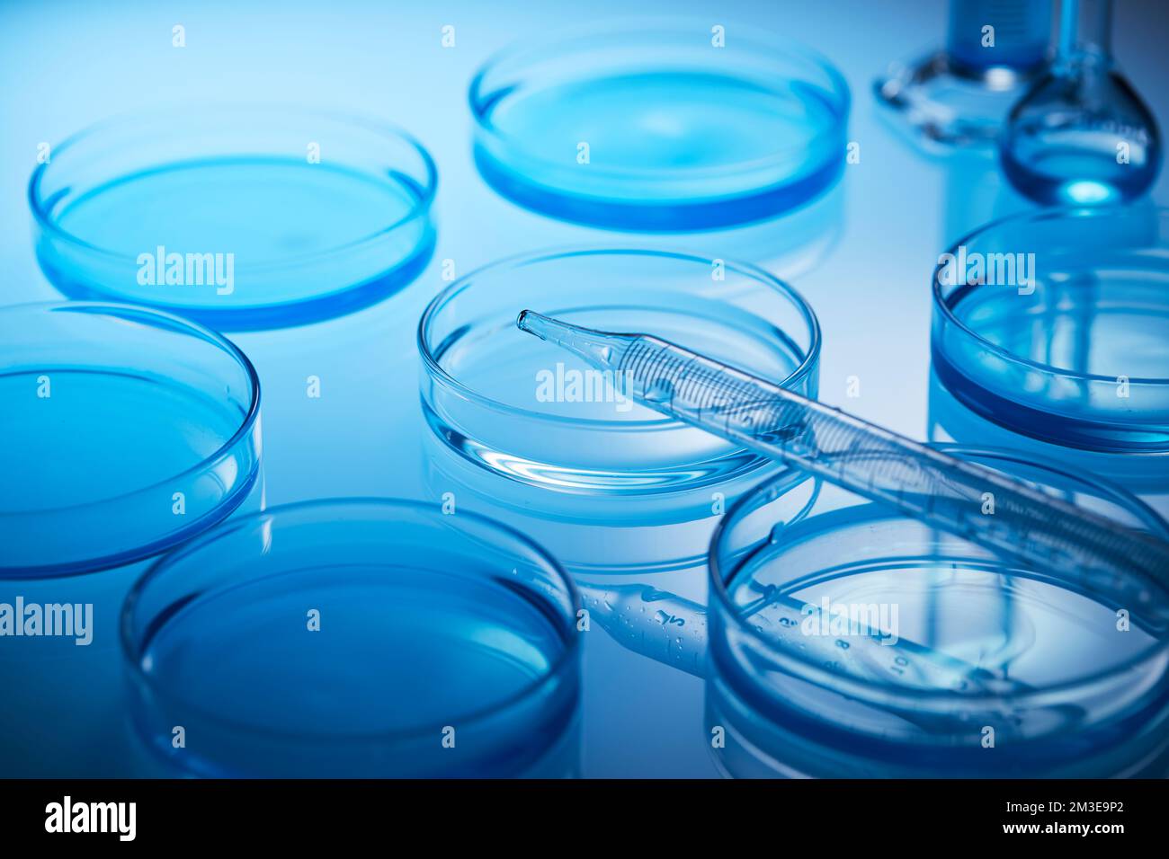 science lab with clear blue background and test tubes with blue ...