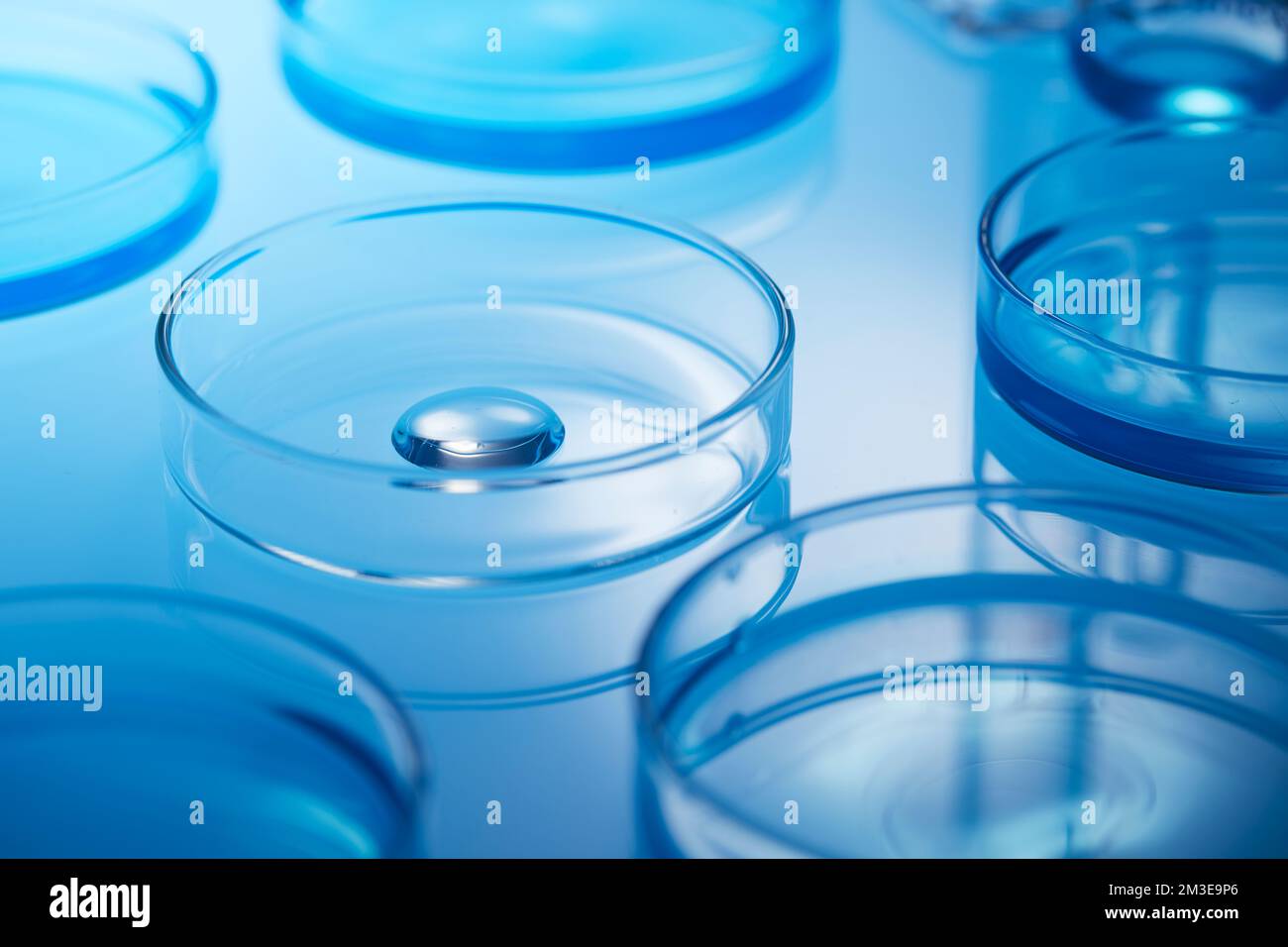 science lab with clear blue background and test tubes with blue ...