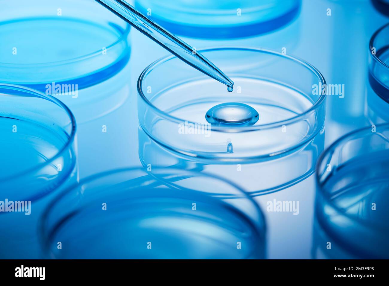 science lab with clear blue background and test tubes with blue ...