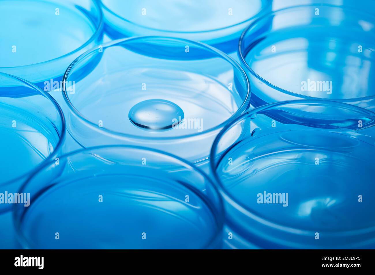 science lab with clear blue background and test tubes with blue ...