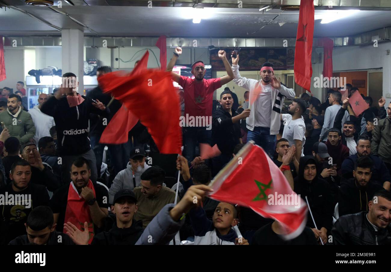 JERUSALEM, ISRAEL - DECEMBER 14: Palestinians cheer Morocco's team as ...