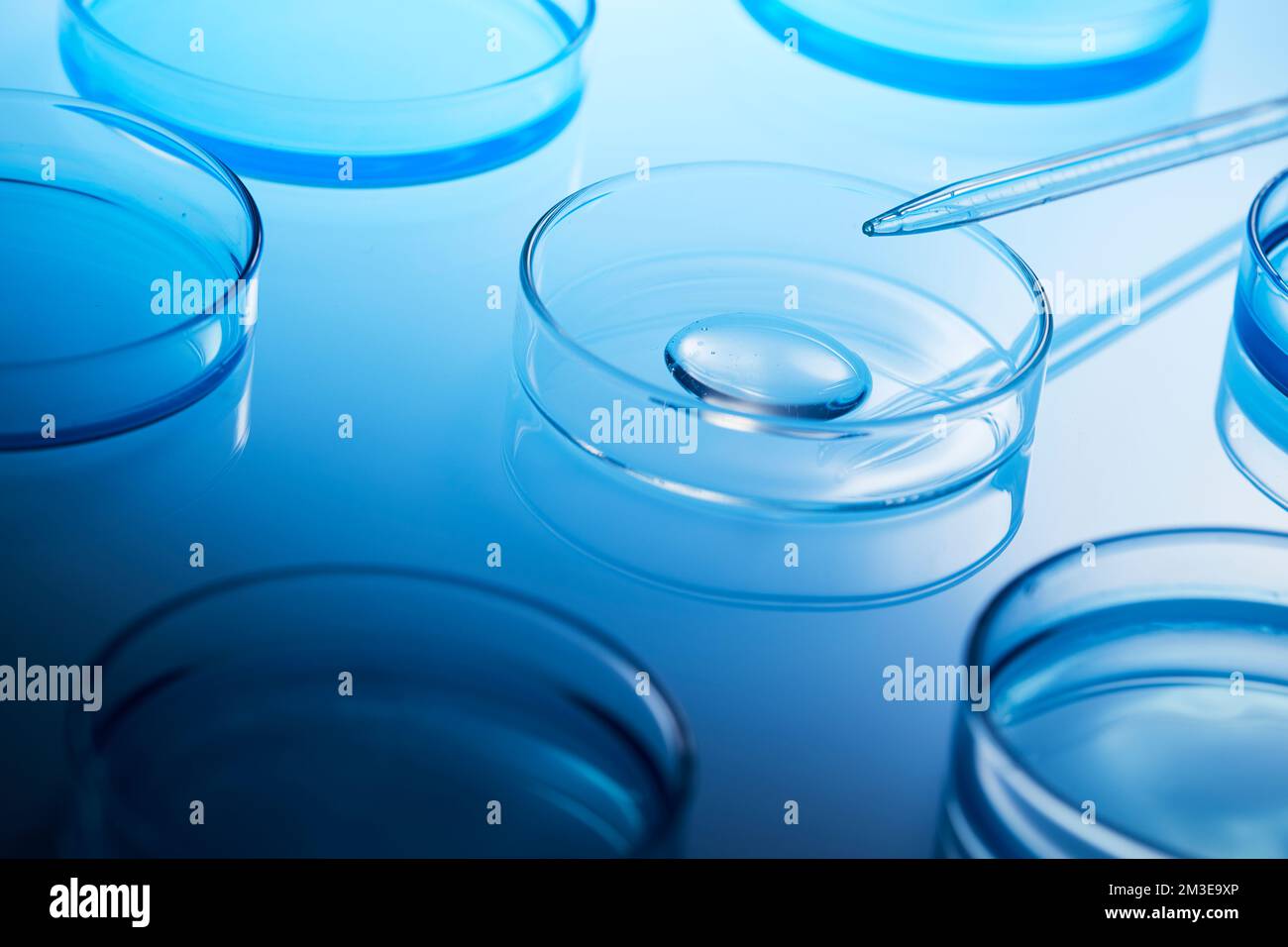 science lab with clear blue background and test tubes with blue ...