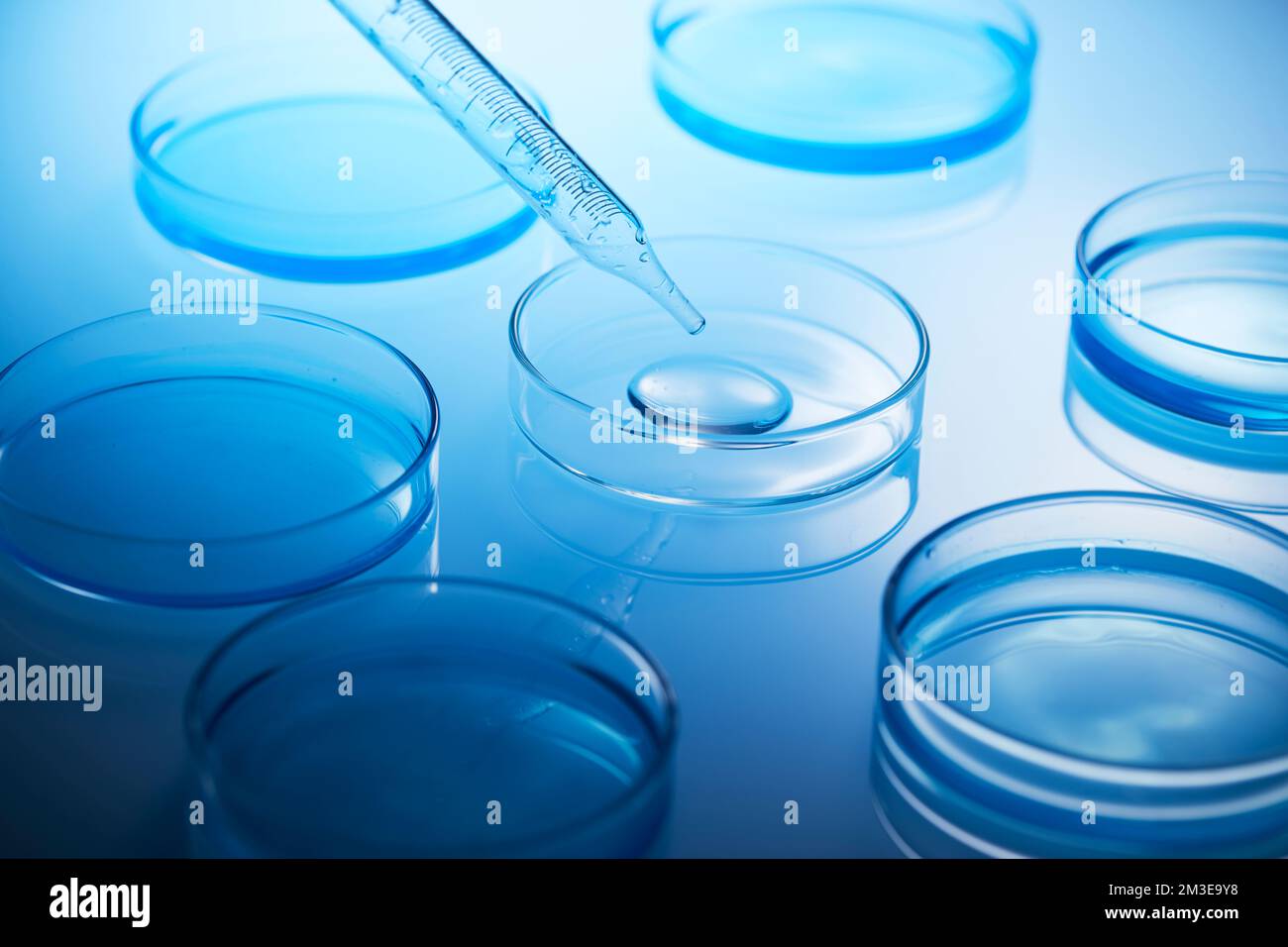 science lab with clear blue background and test tubes with blue ...