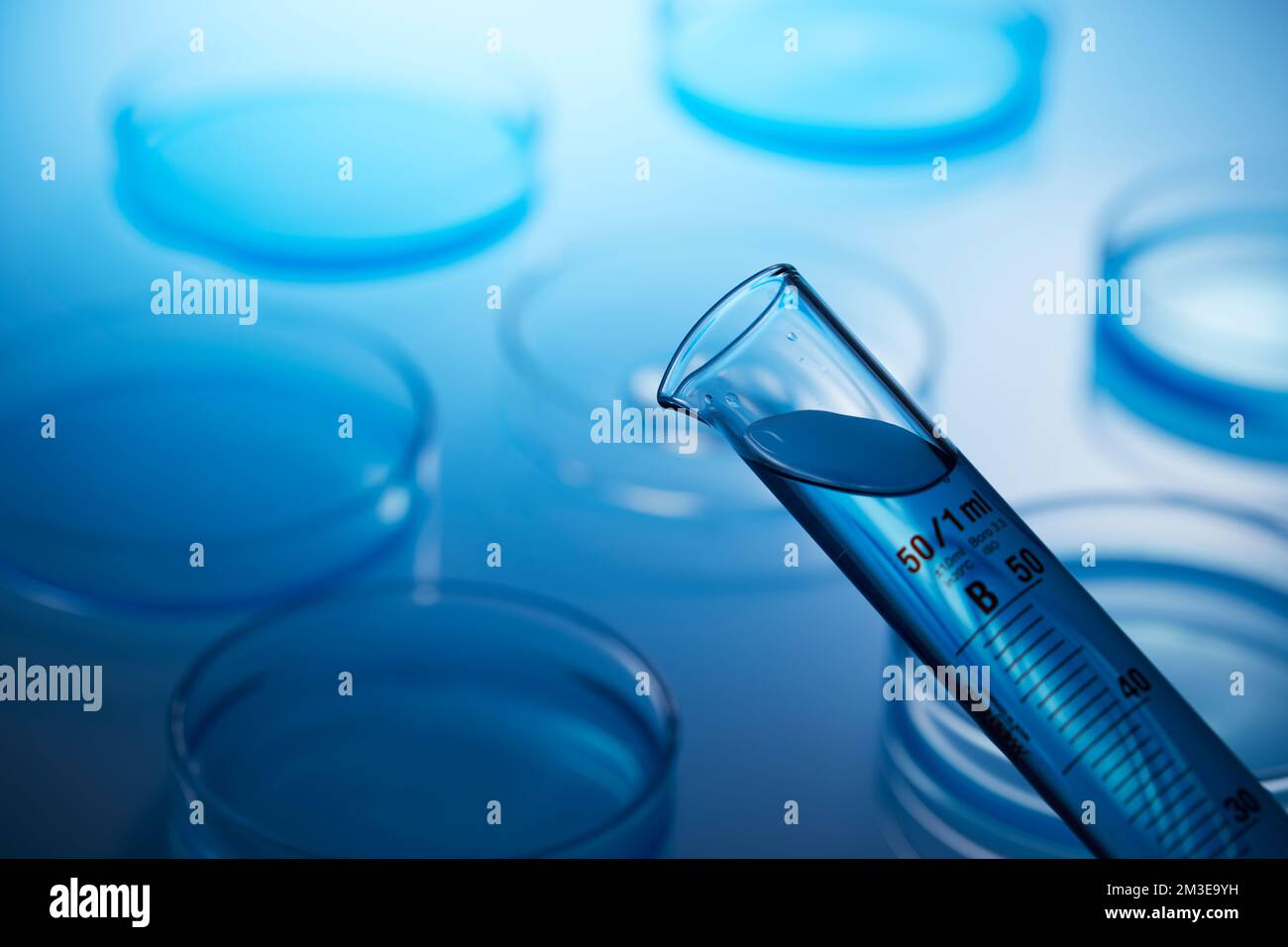 science lab with clear blue background and test tubes with blue ...
