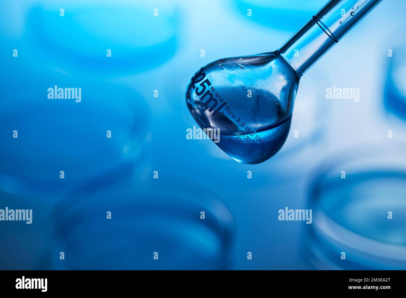 science lab with clear blue background and test tubes with blue ...