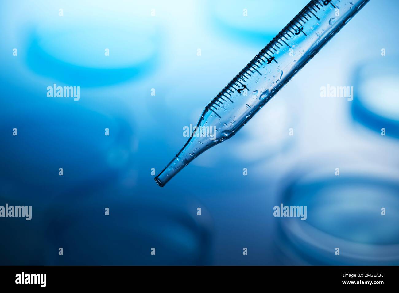 science lab with clear blue background and test tubes with blue ...