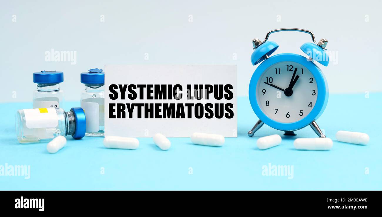 Medicine and health concept. An alarm clock, pills, injections and a ...