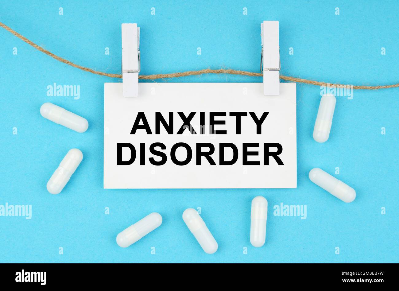 Medical concept. On a blue surface, on a rope with paper clips, there ...