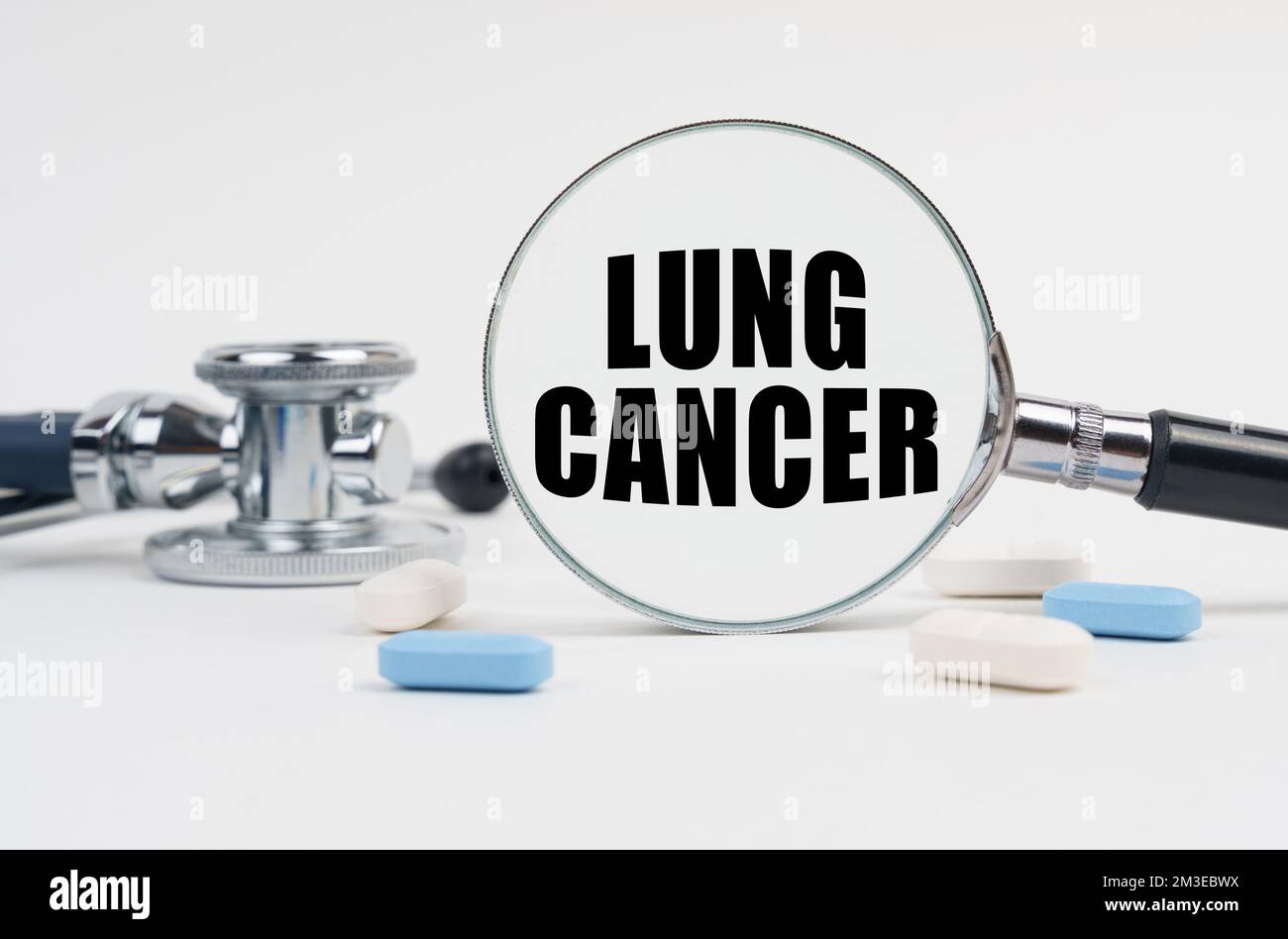 Medicine and health concept. On a white surface lie pills, a ...