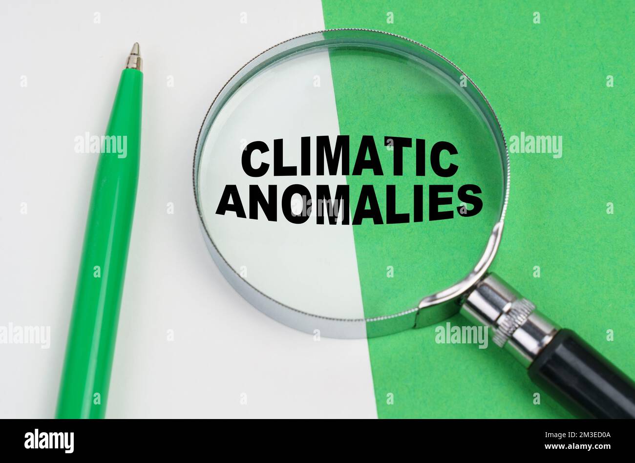 Ecological concept. On a white-green background lies a pen and a ...