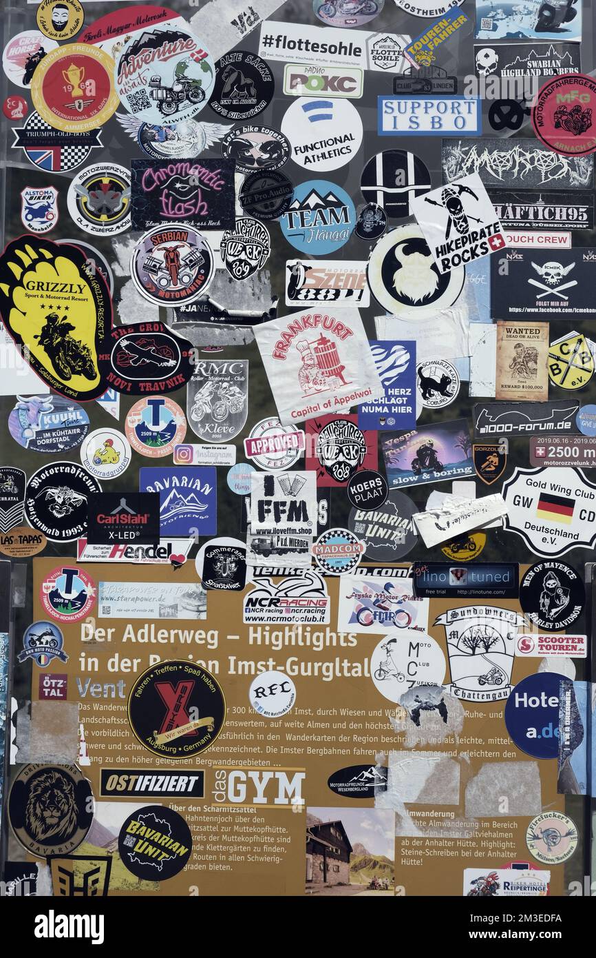 Colorful stickers on a street sign Stock Photo - Alamy