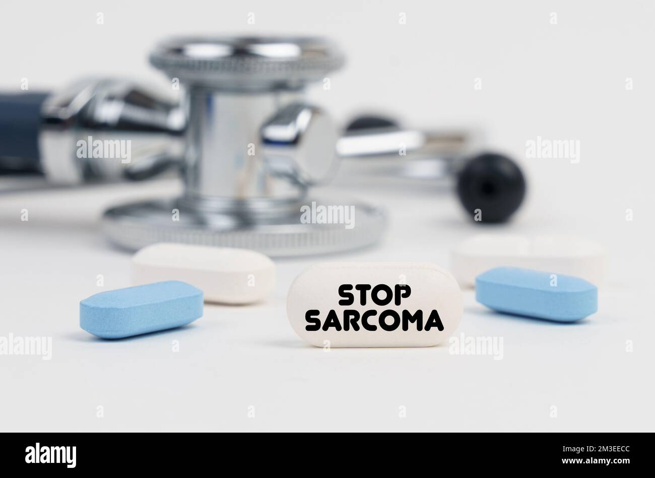 Medicine and health concept. On a white surface lie pills, a ...