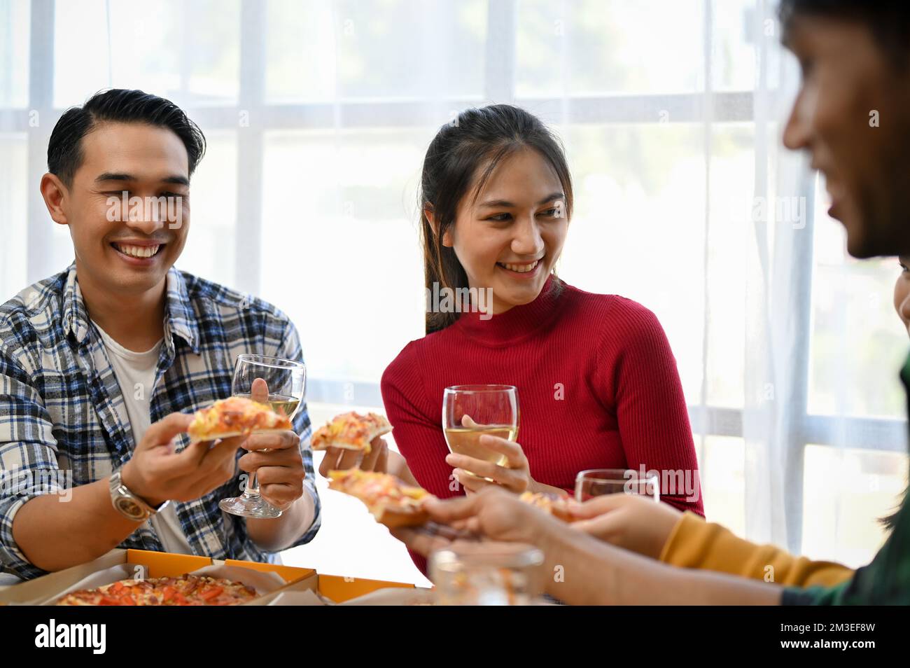 Group of diversity Asian friends enjoy talking, drinking wine and ...