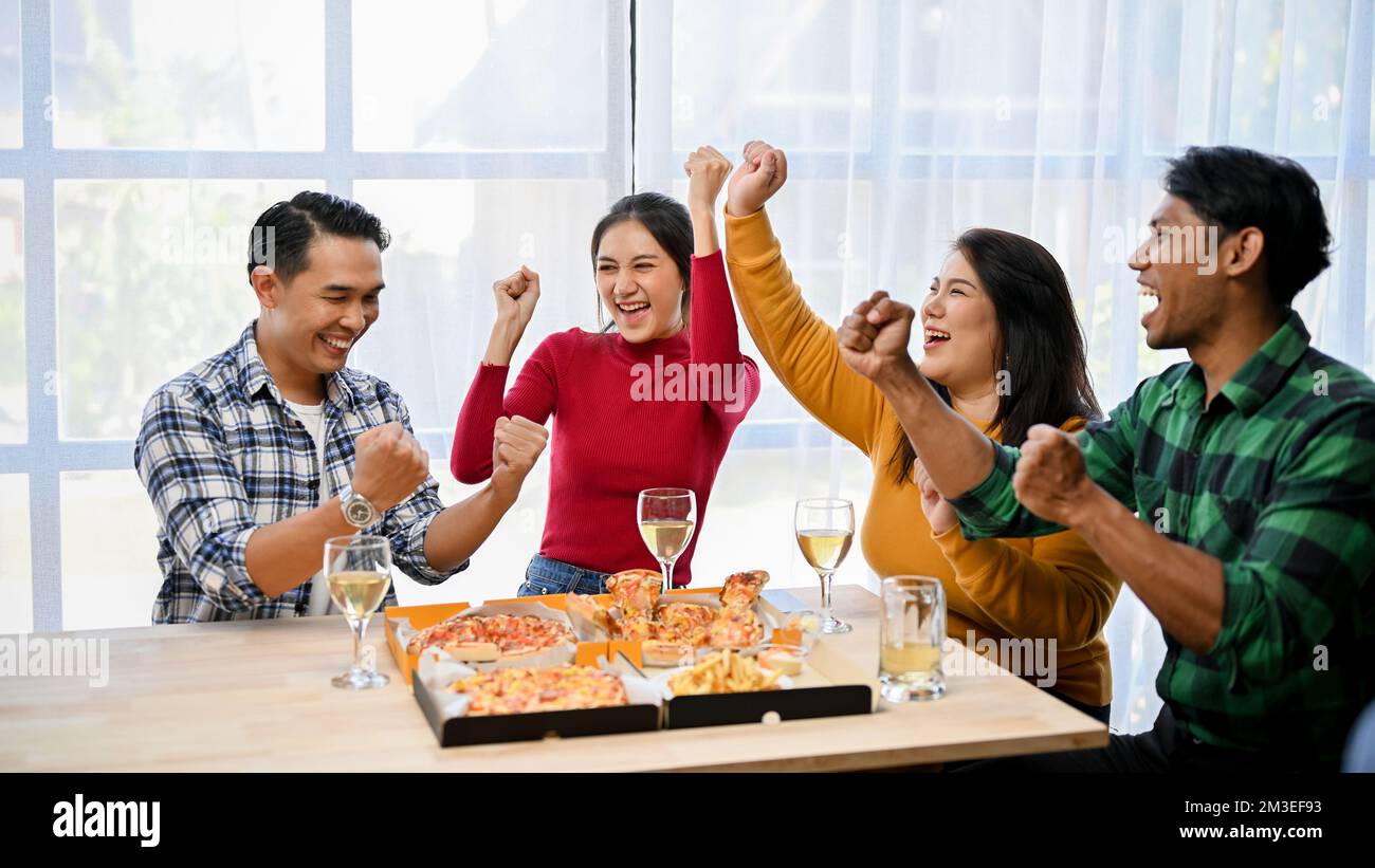 Group of overjoyed Asian friends laughing, screaming, cheering up ...
