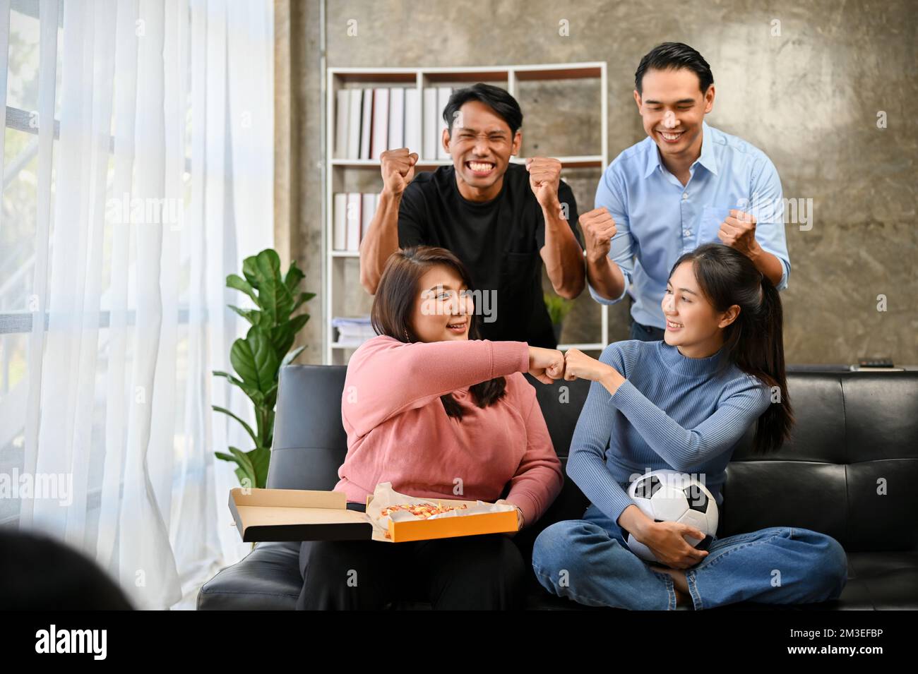 Excited and overjoyed Asian sports football fans celebrate their ...