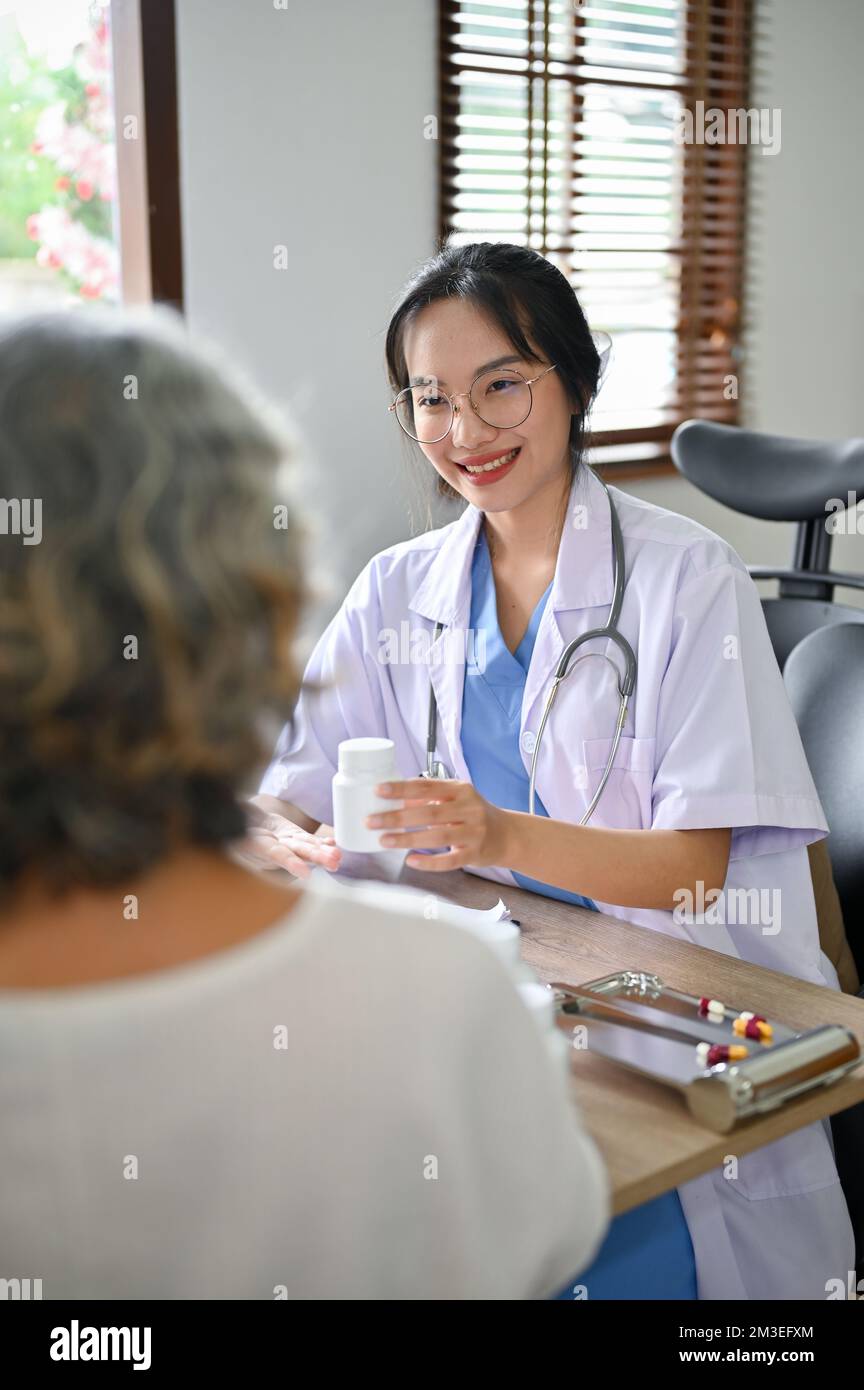 Portrait, Charming and professional millennial Asian female doctor ...