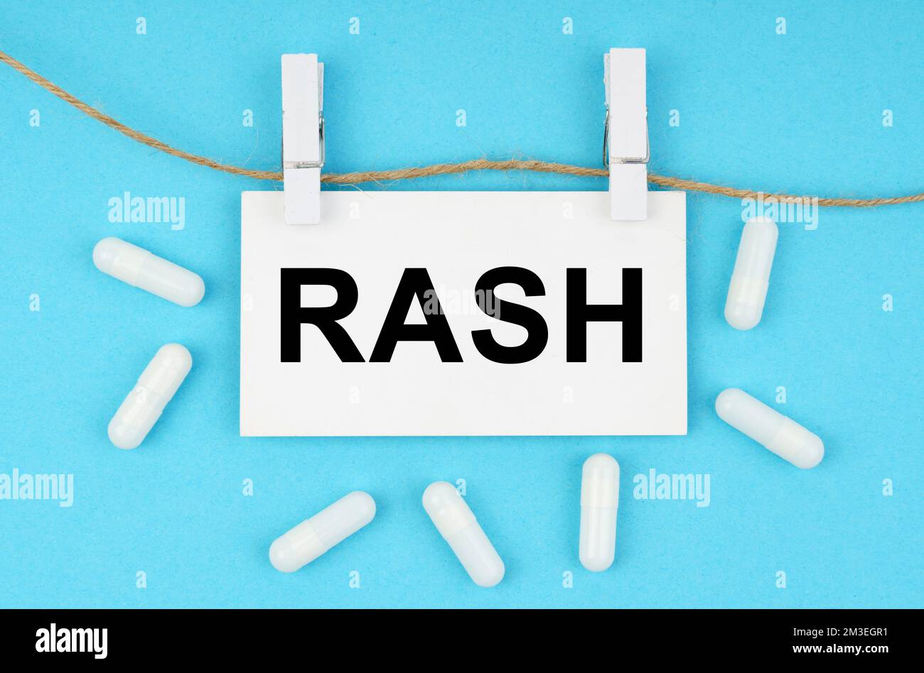 Medical concept. On a blue surface, on a rope with paper clips, there ...