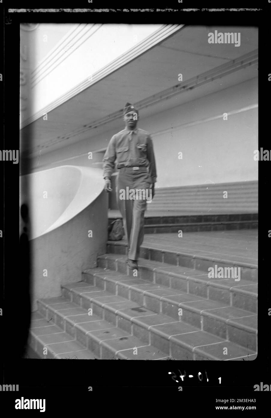 A man in military uniform walking down stairs , Soldiers, Stairways ...