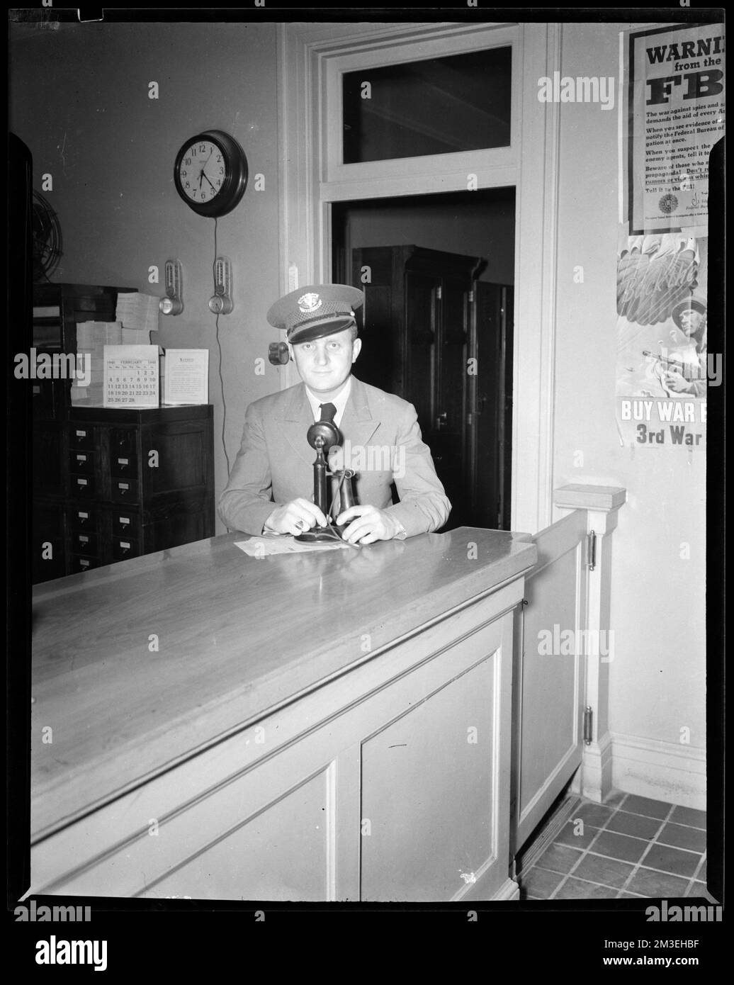 Man in military uniform standing at counter with a telephone , Soldiers ...
