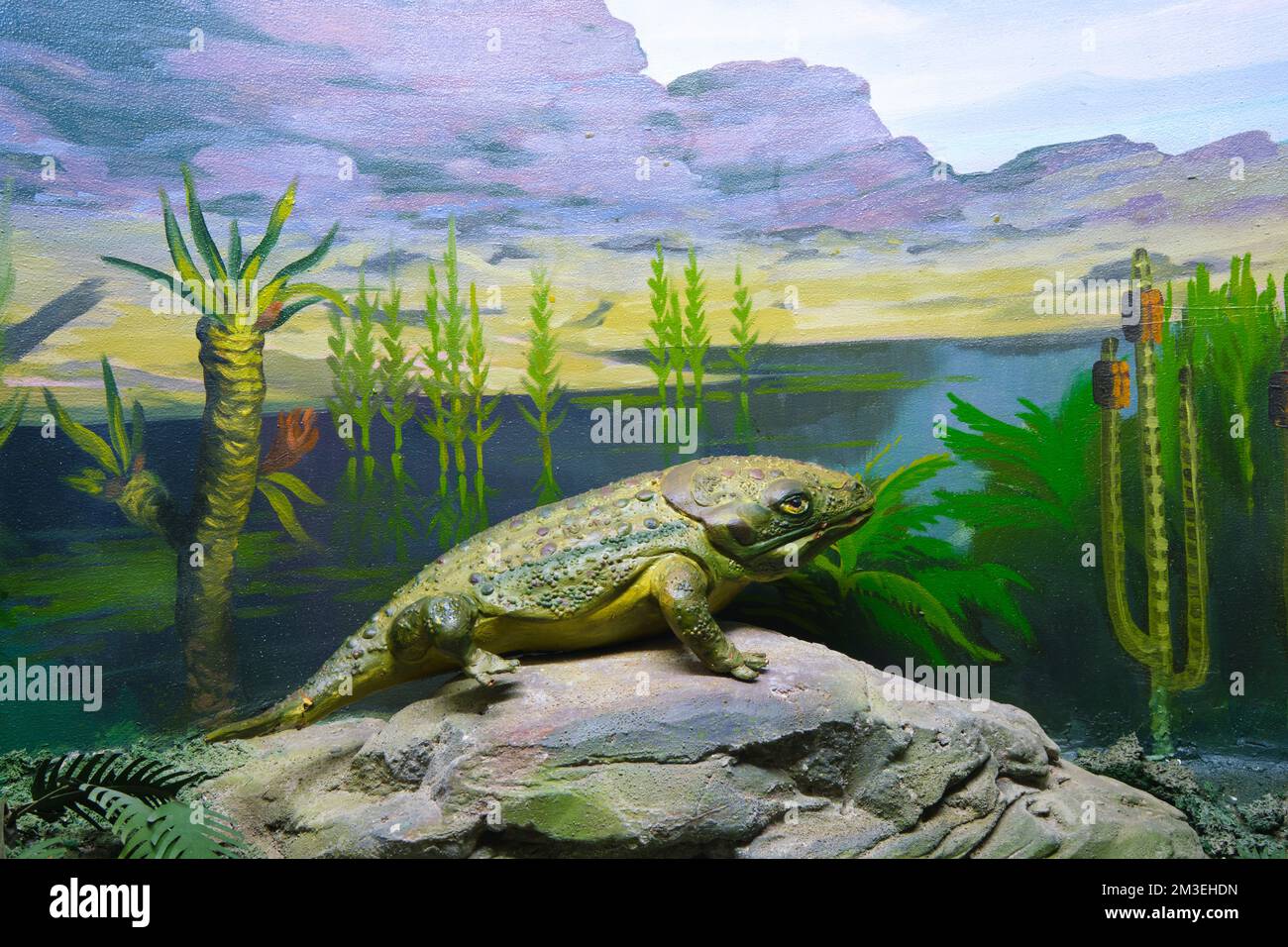 A frog-like sea creature on a rock, a recreation of an ancient ...