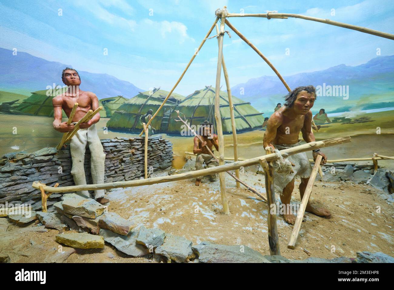Cave, Stone Age men, busy building housing from sticks, wood. Detail of ...