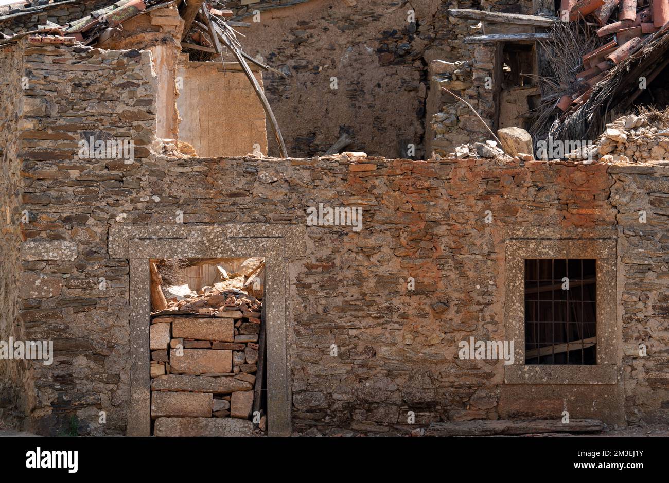 Old ruined stone house facade, front view Stock Photo - Alamy