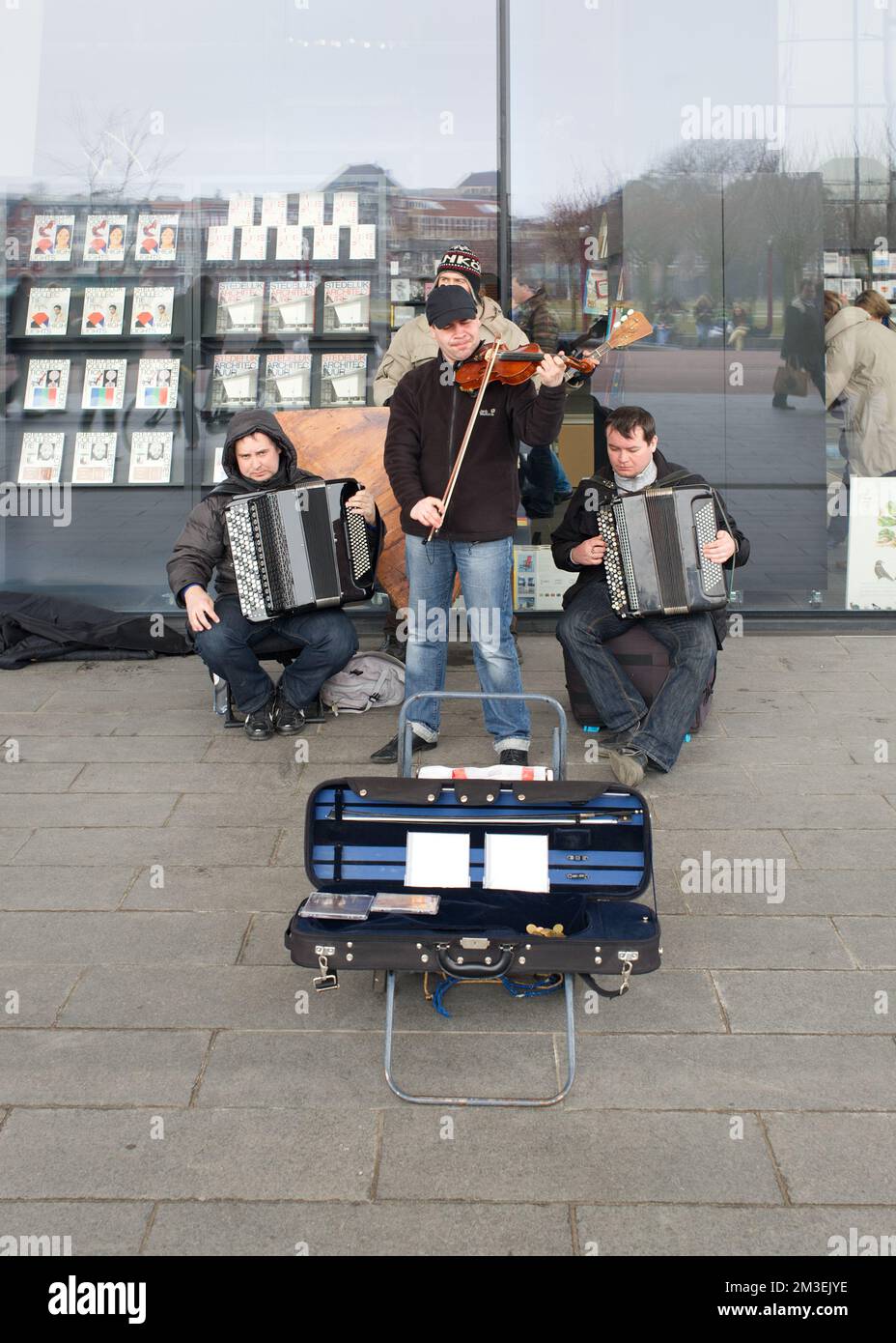 Folk music quartet performing on the street in Amsterdam, Netherlands ...