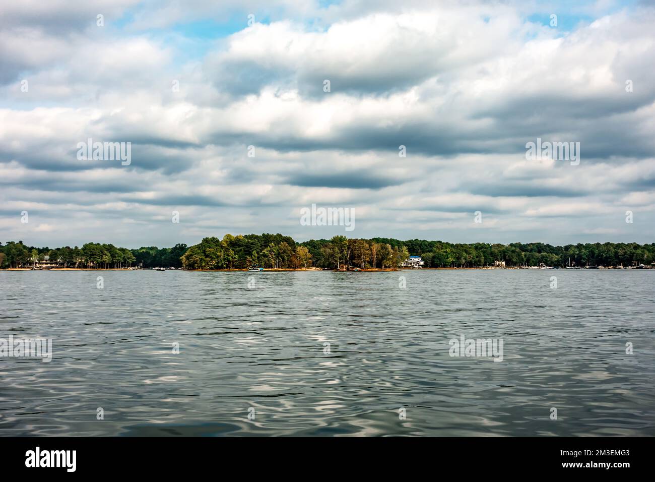 A beautiful scene of lake Norman with beautiful green trees on the ...