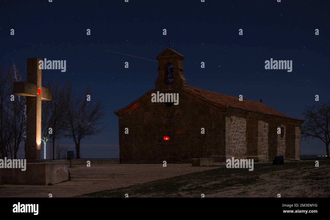 A night view of typical small renovated stone church in a rural village ...