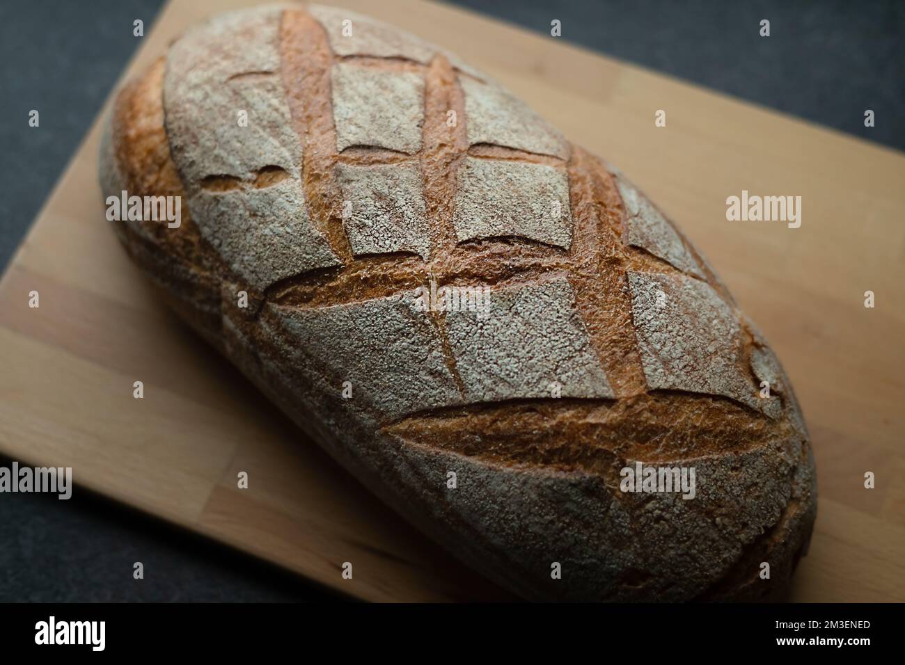 Flour freshly baked loaf bread wooden table hi-res stock photography ...