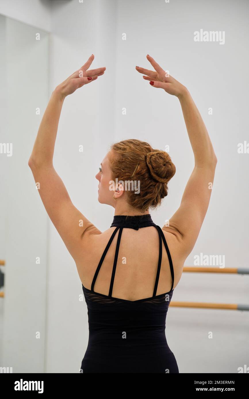 Back view of young ballerina dancing in a ballet school Stock Photo - Alamy