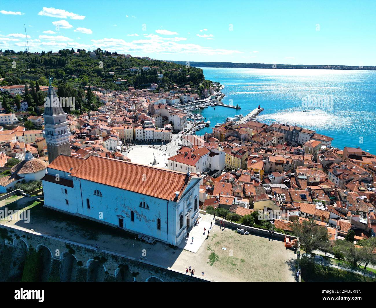 Cerkev sv. Stefana, Piran church Piran Slovenia on sunny day drone aerial view Stock Photo - Alamy