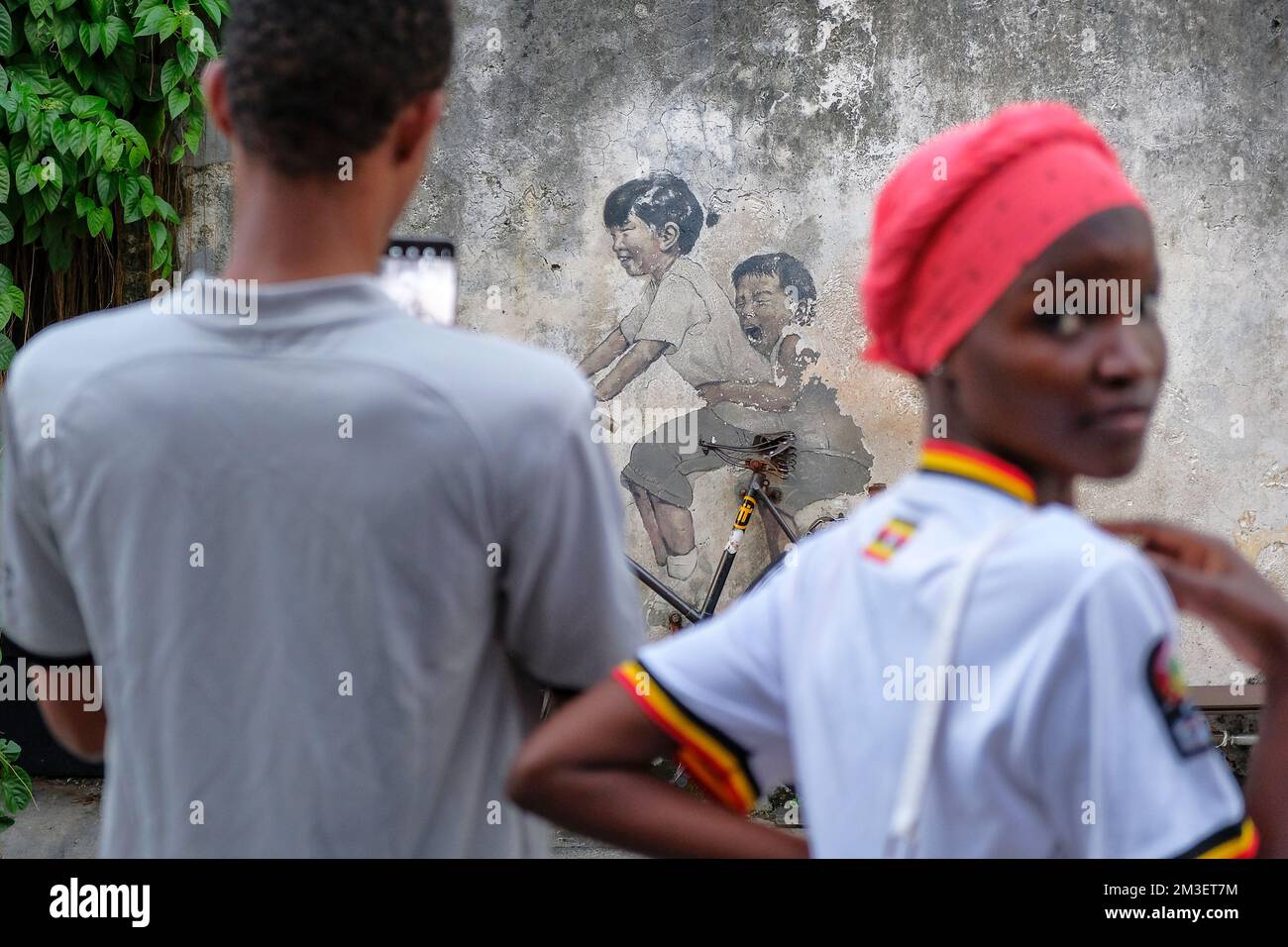 George Town, Malaysia - November 2022: Tourists taking pictures with a ...
