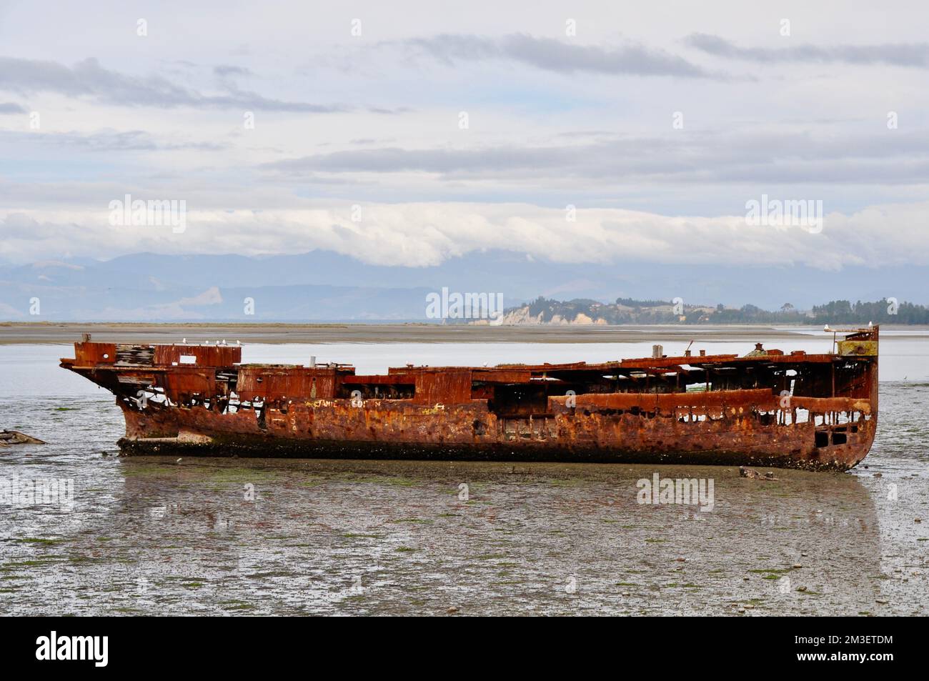 The old rusted wrecks of a ship on the beach Stock Photo - Alamy
