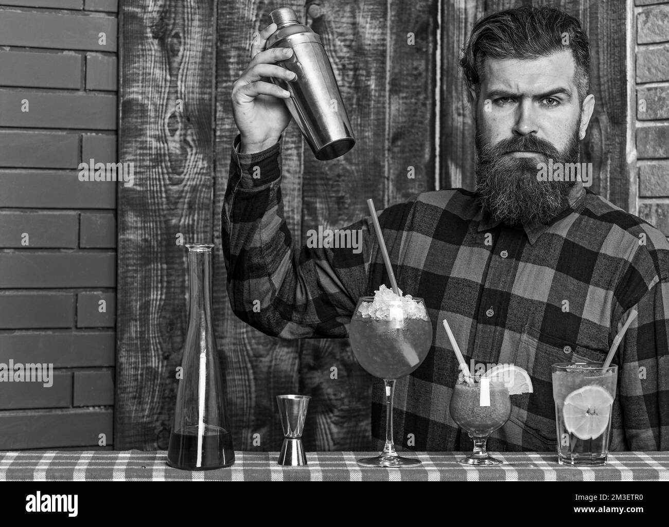Man in checkered shirt on wooden texture background Stock Photo - Alamy