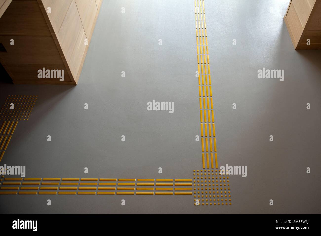 Bright yellow tactile paving for the visually impaired Stock Photo - Alamy