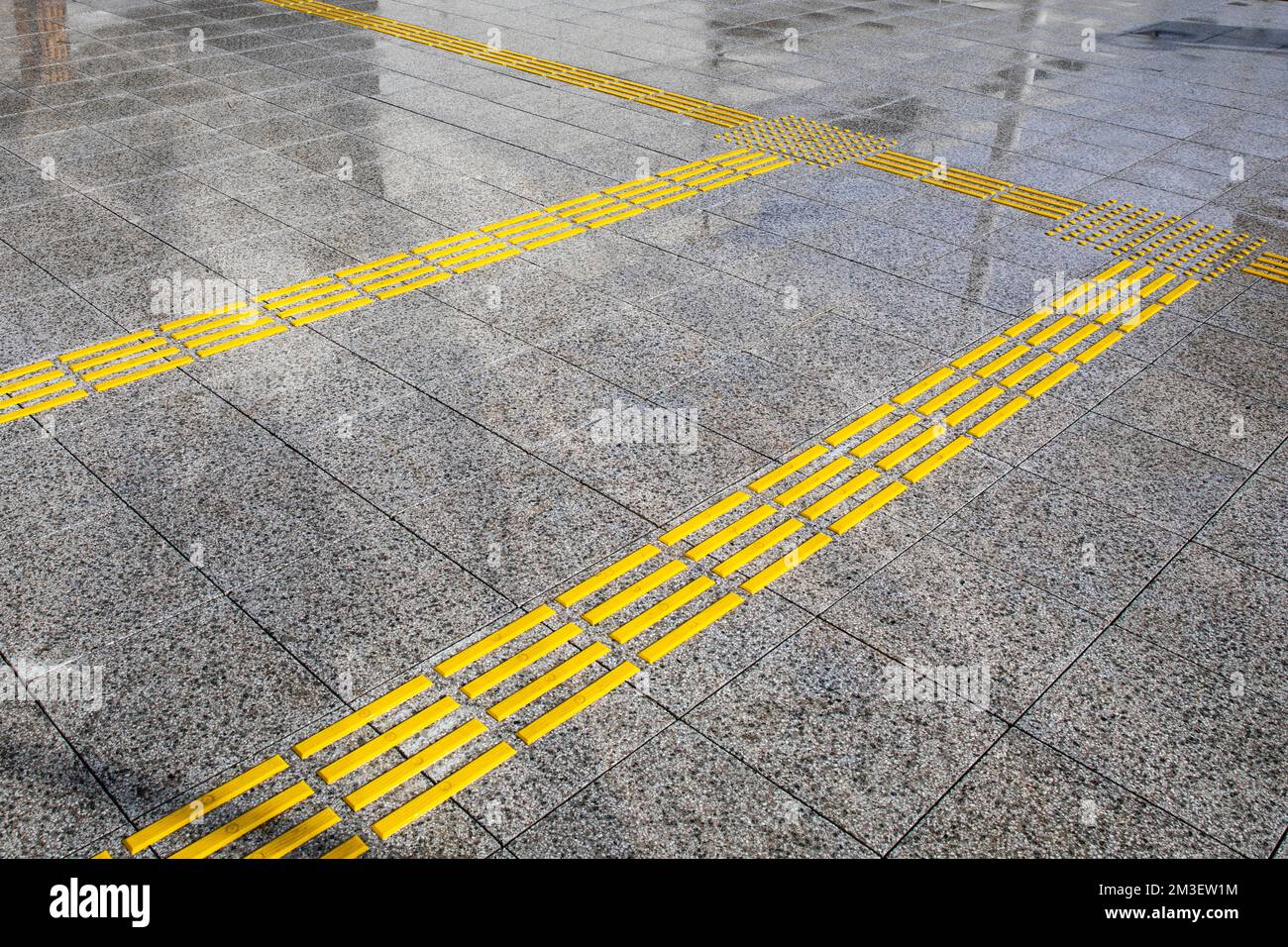 Bright yellow tactile paving for the visually impaired Stock Photo - Alamy