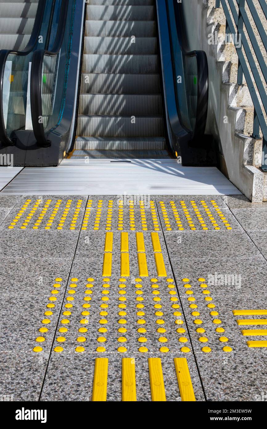 Bright yellow tactile paving for the visually impaired Stock Photo - Alamy