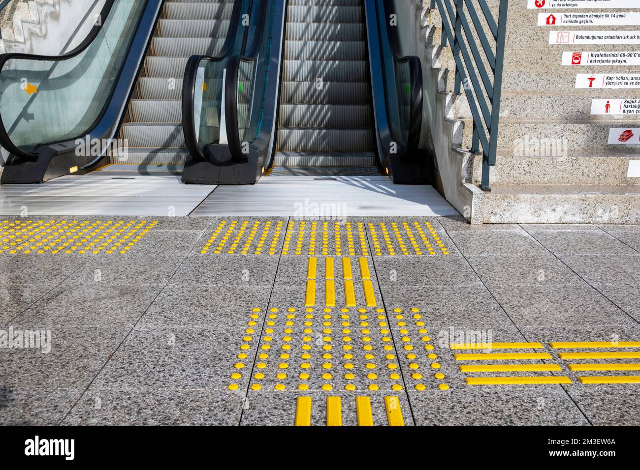 Bright yellow tactile paving for the visually impaired Stock Photo - Alamy