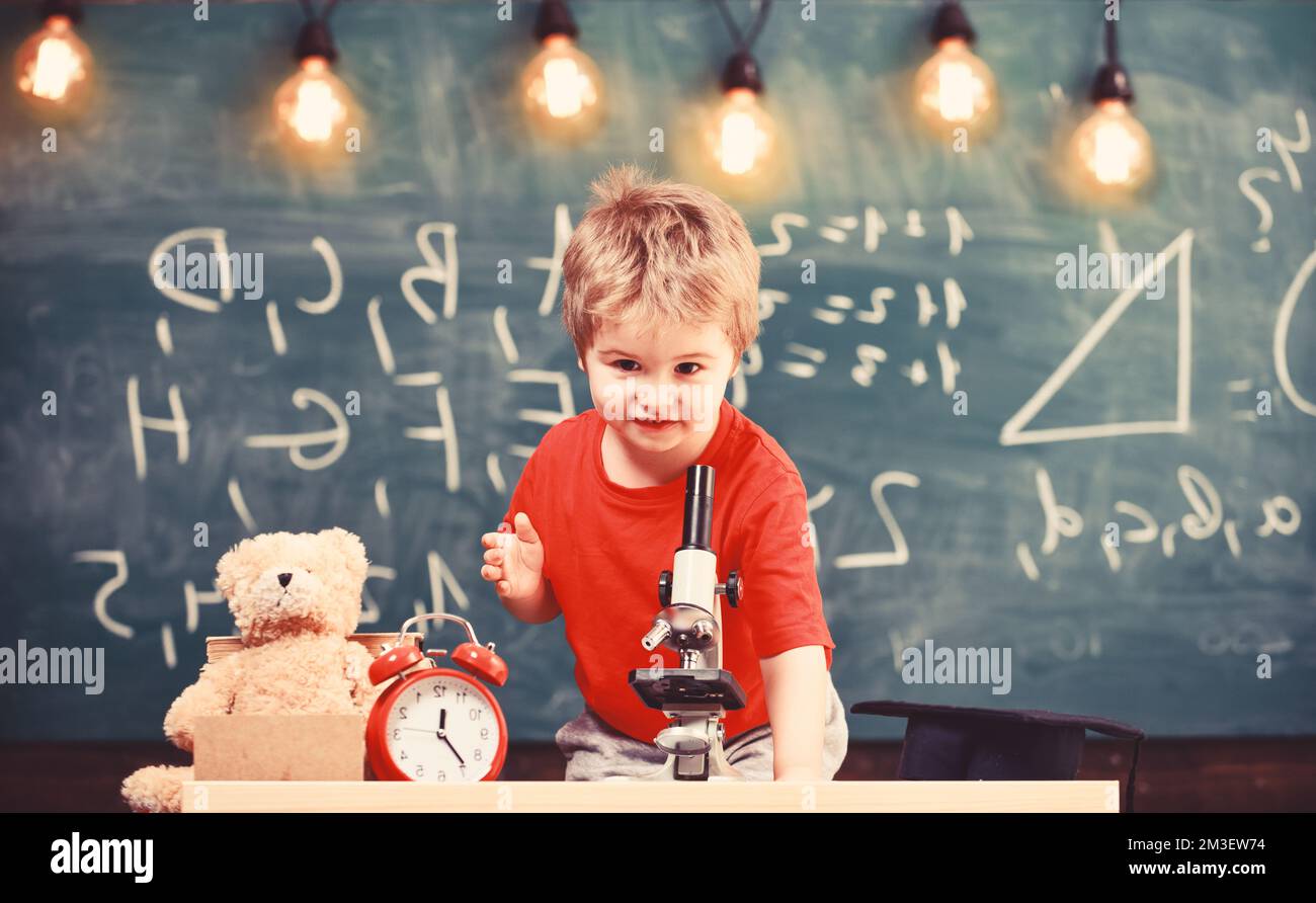 First former interested in studying, learning, education. Kid boy near ...