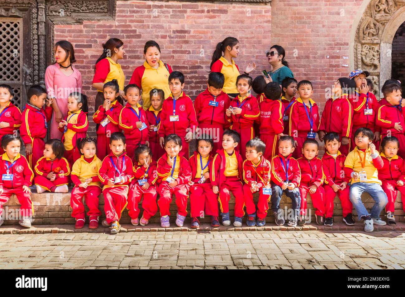 Class of Nepalese school children posing for a picture on Durbar square ...