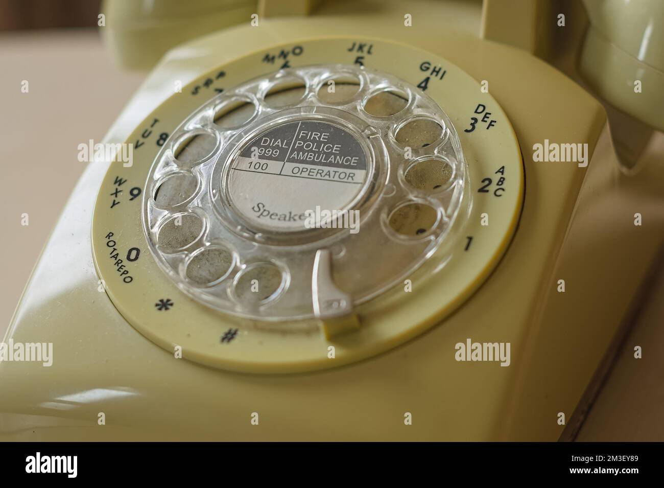 Close-up of rotary dial telephone in the home showing 999 emergency ...
