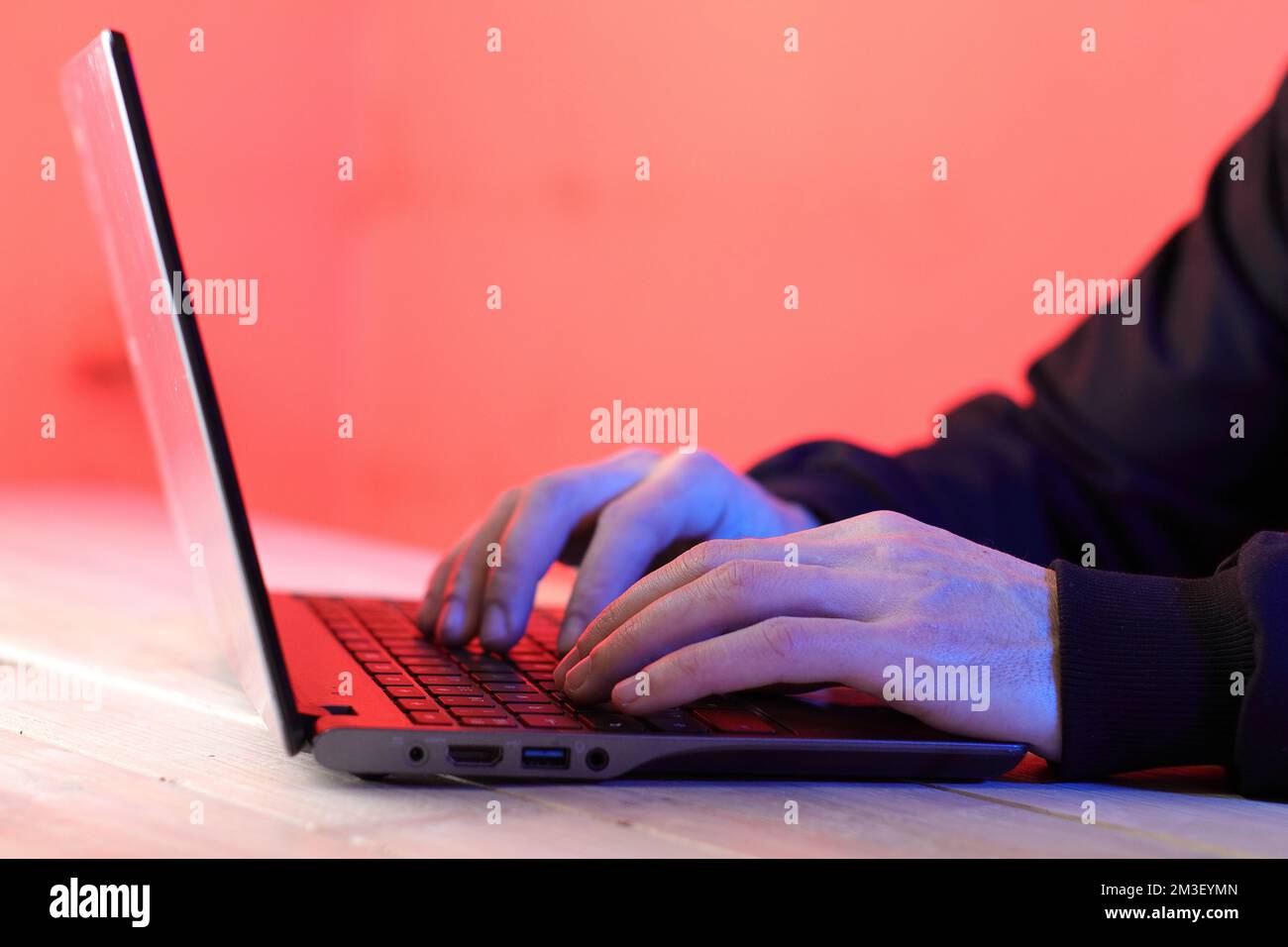 typing on laptop keyboard on table and colored background Stock Photo ...