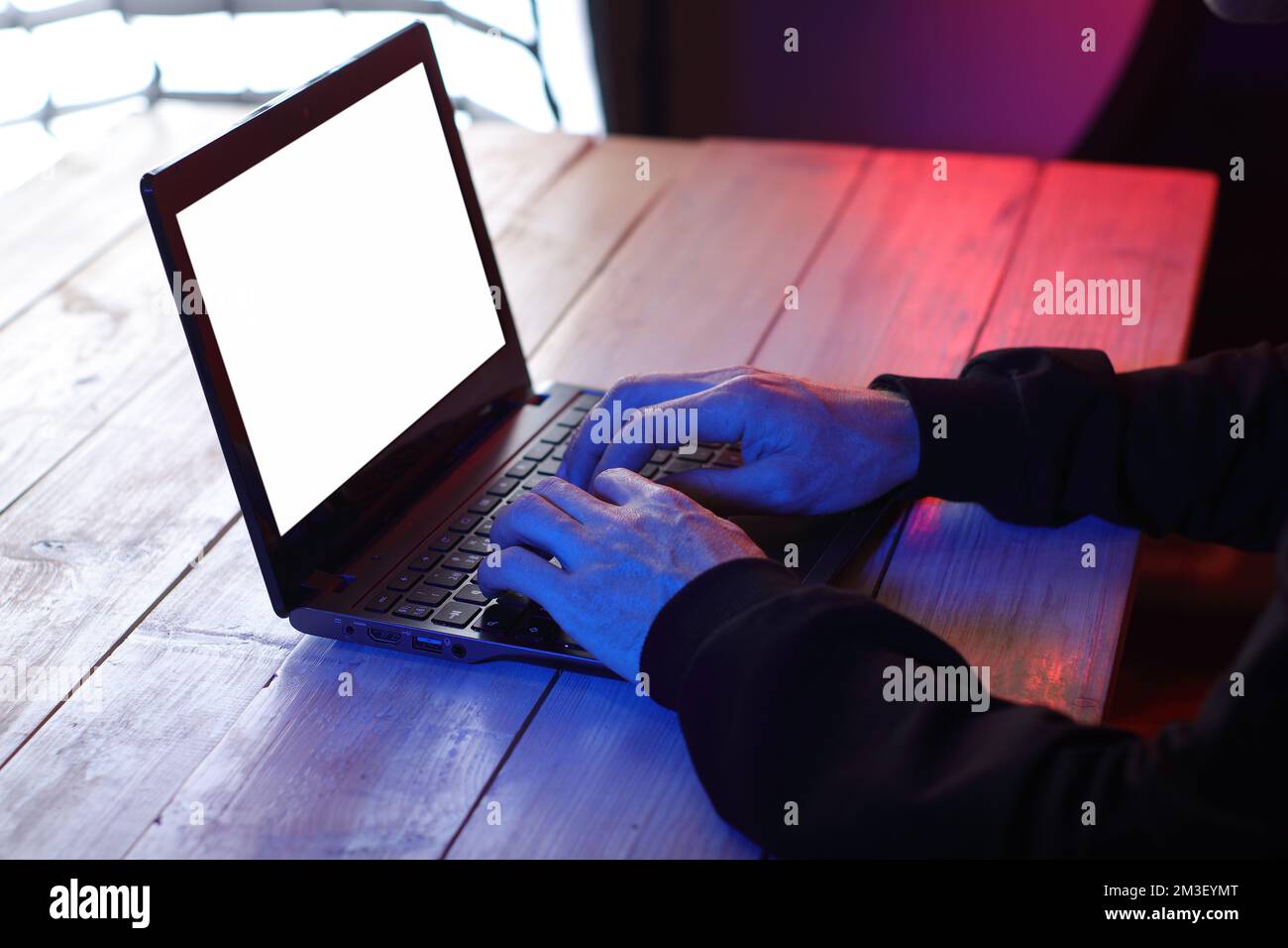 typing on laptop keyboard on table and colored background Stock Photo ...