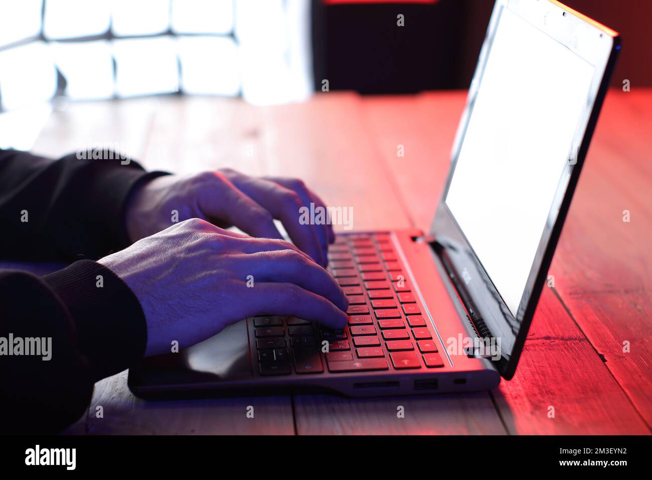 typing on laptop keyboard on table and colored background Stock Photo ...